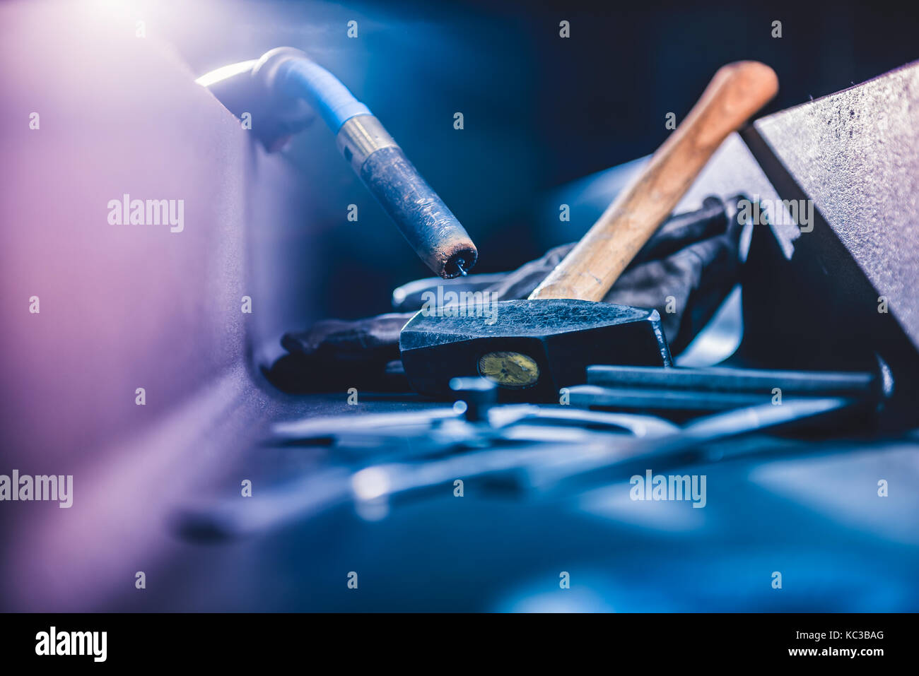Industrial welding tool in big metal profile background Stock Photo - Alamy