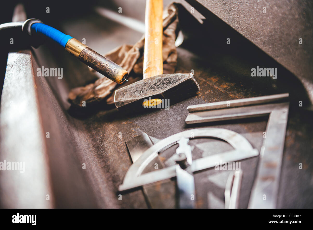Industrial welding tool in big metal profile background Stock Photo - Alamy