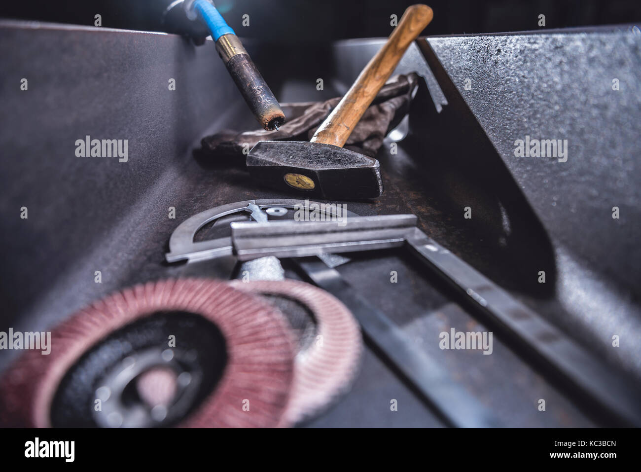 Industrial welding tool in big metal profile background Stock Photo - Alamy