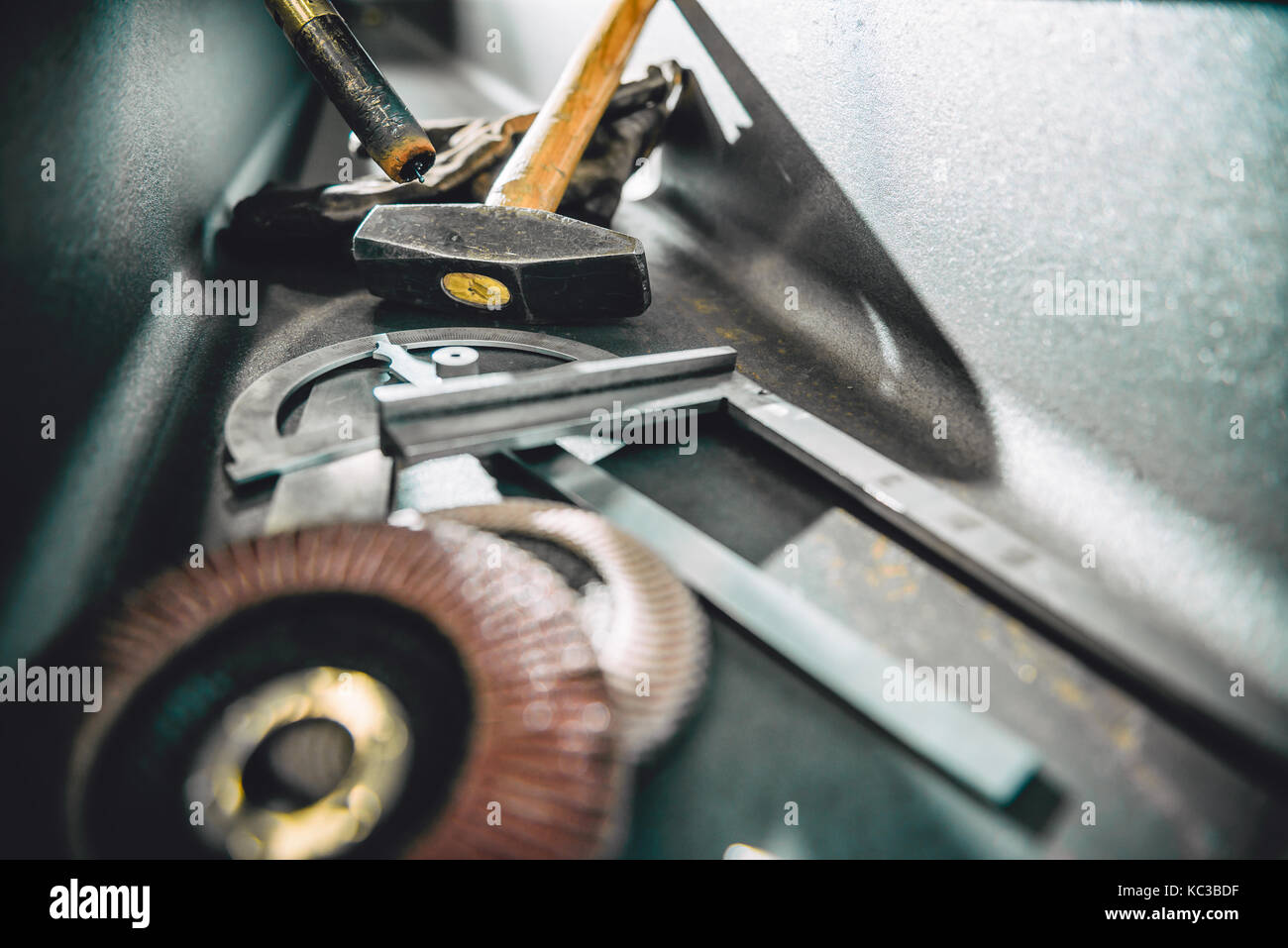 Industrial welding tool in big metal profile background Stock Photo - Alamy