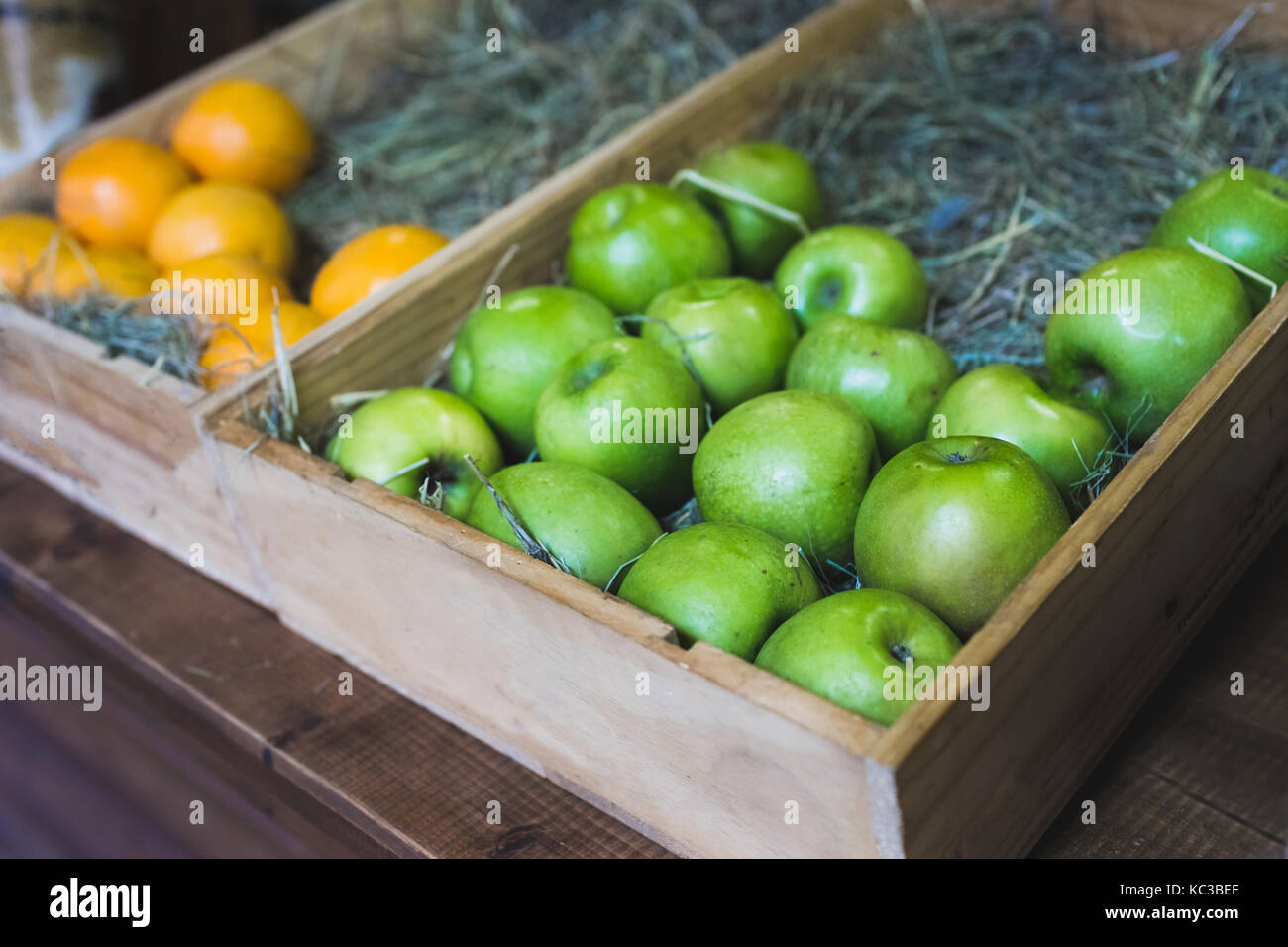 Wooden box with fresh green apples on display in a fruit shop Stock ...