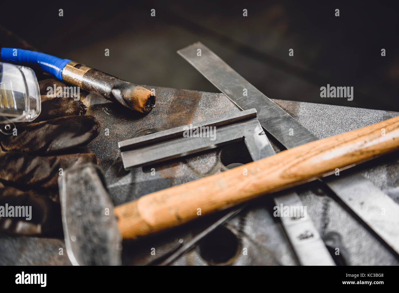 Industrial welding tool on metal profile background Stock Photo - Alamy