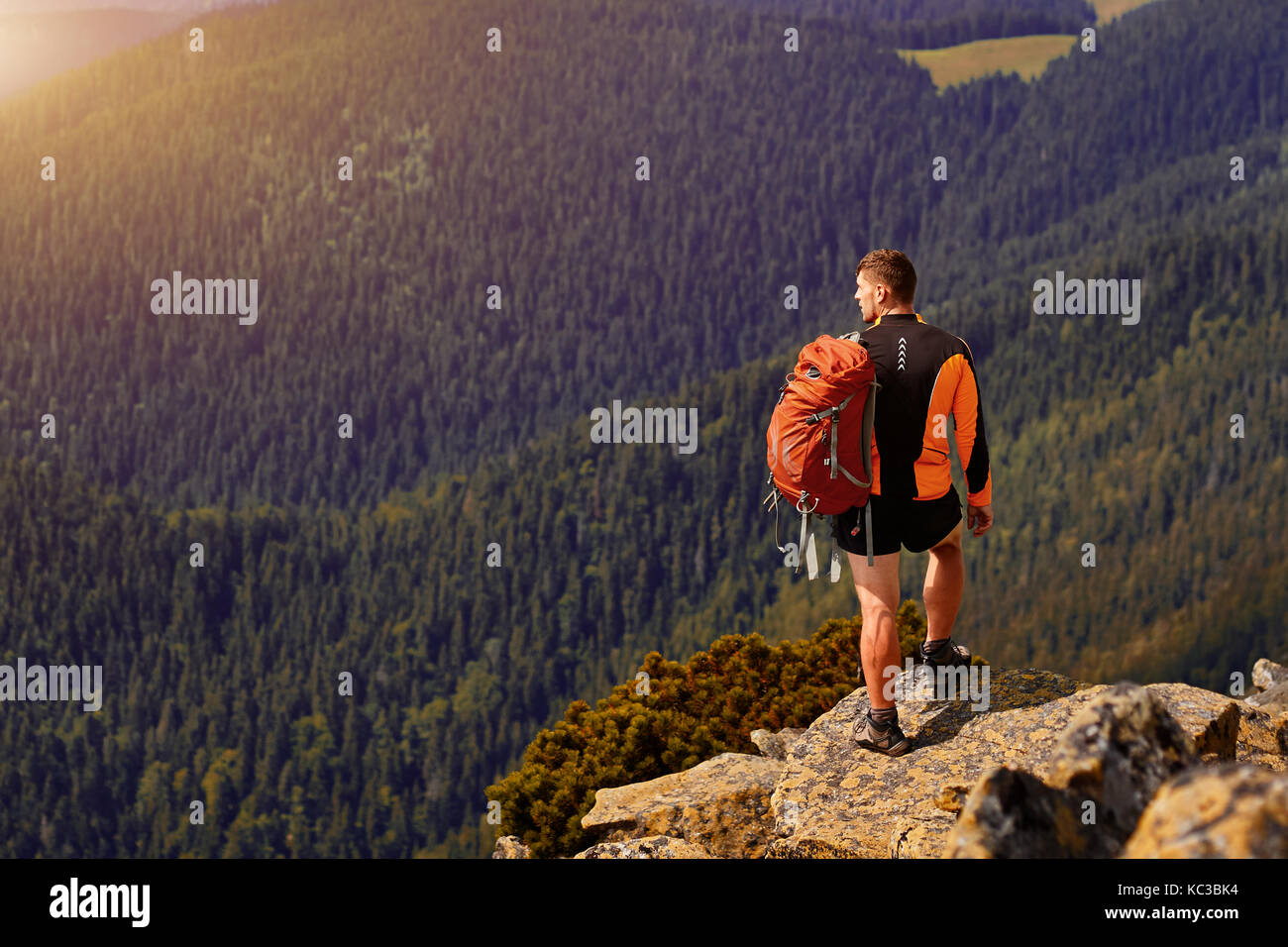 Male traveler from back in the mountains Stock Photo - Alamy