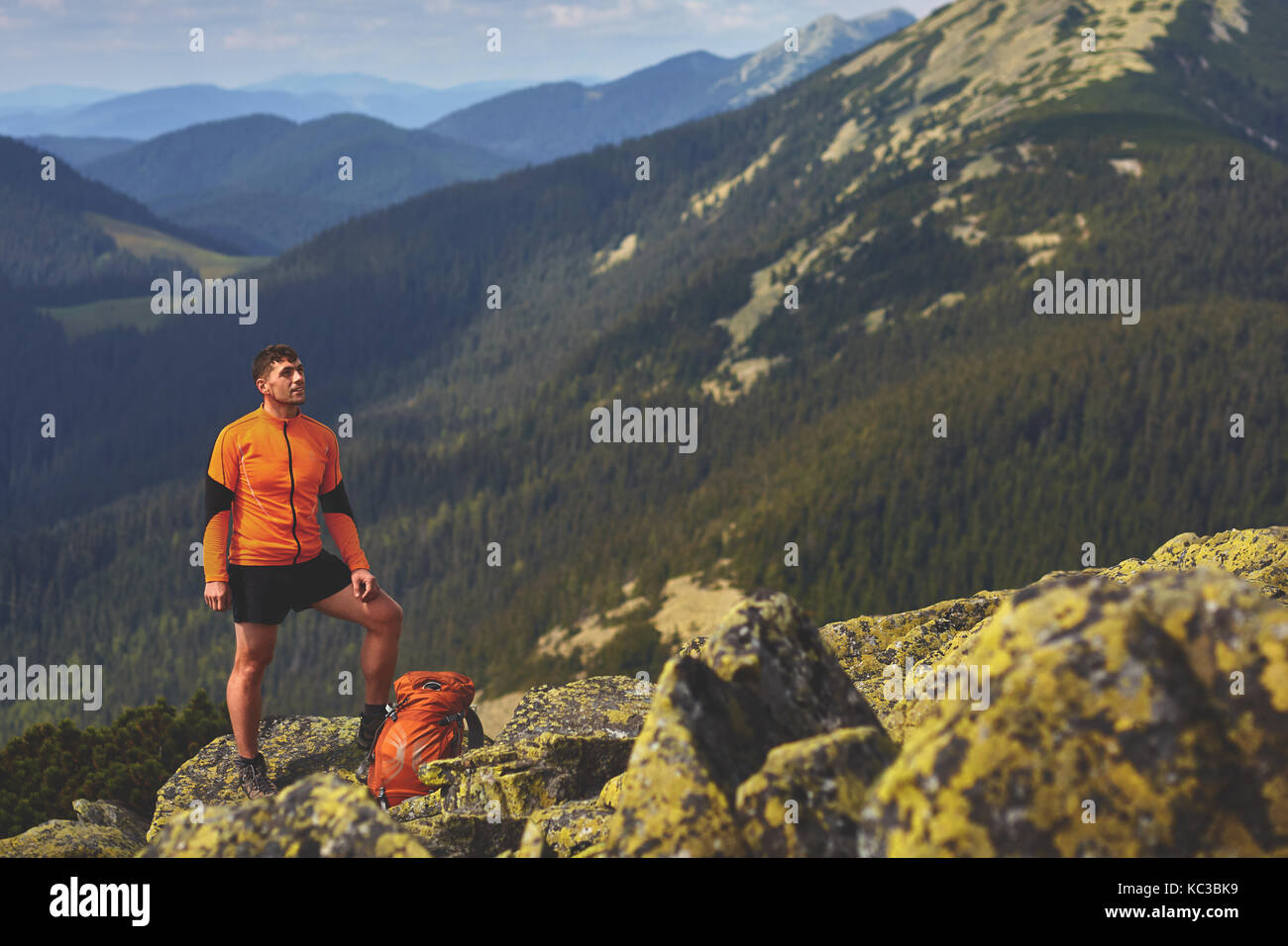 Happy hiker winning reaching life goal, success, freedom and happiness ...