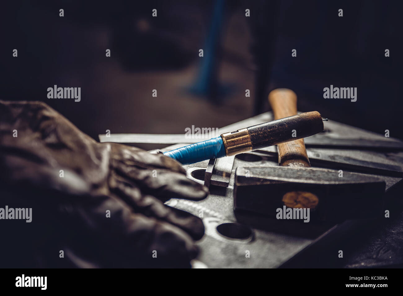 Industrial welding tool on metal profile background Stock Photo - Alamy