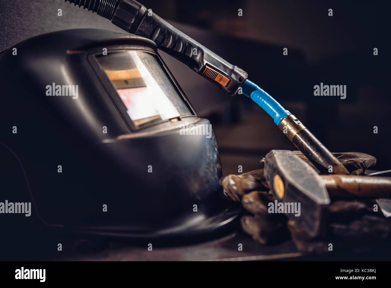 Industrial welding tool on metal profile background Stock Photo - Alamy