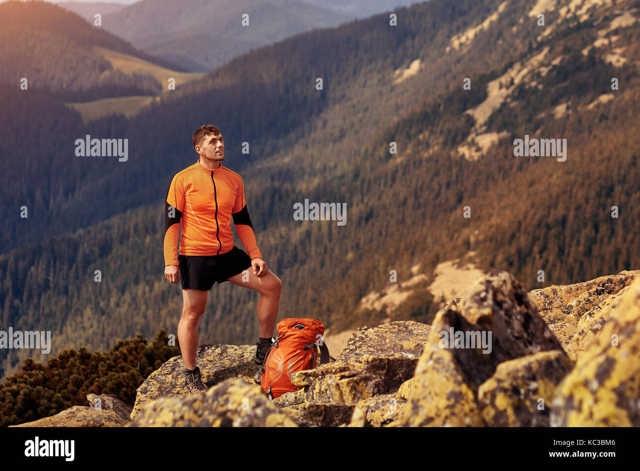 Happy hiker winning reaching life goal, success, freedom and happiness ...