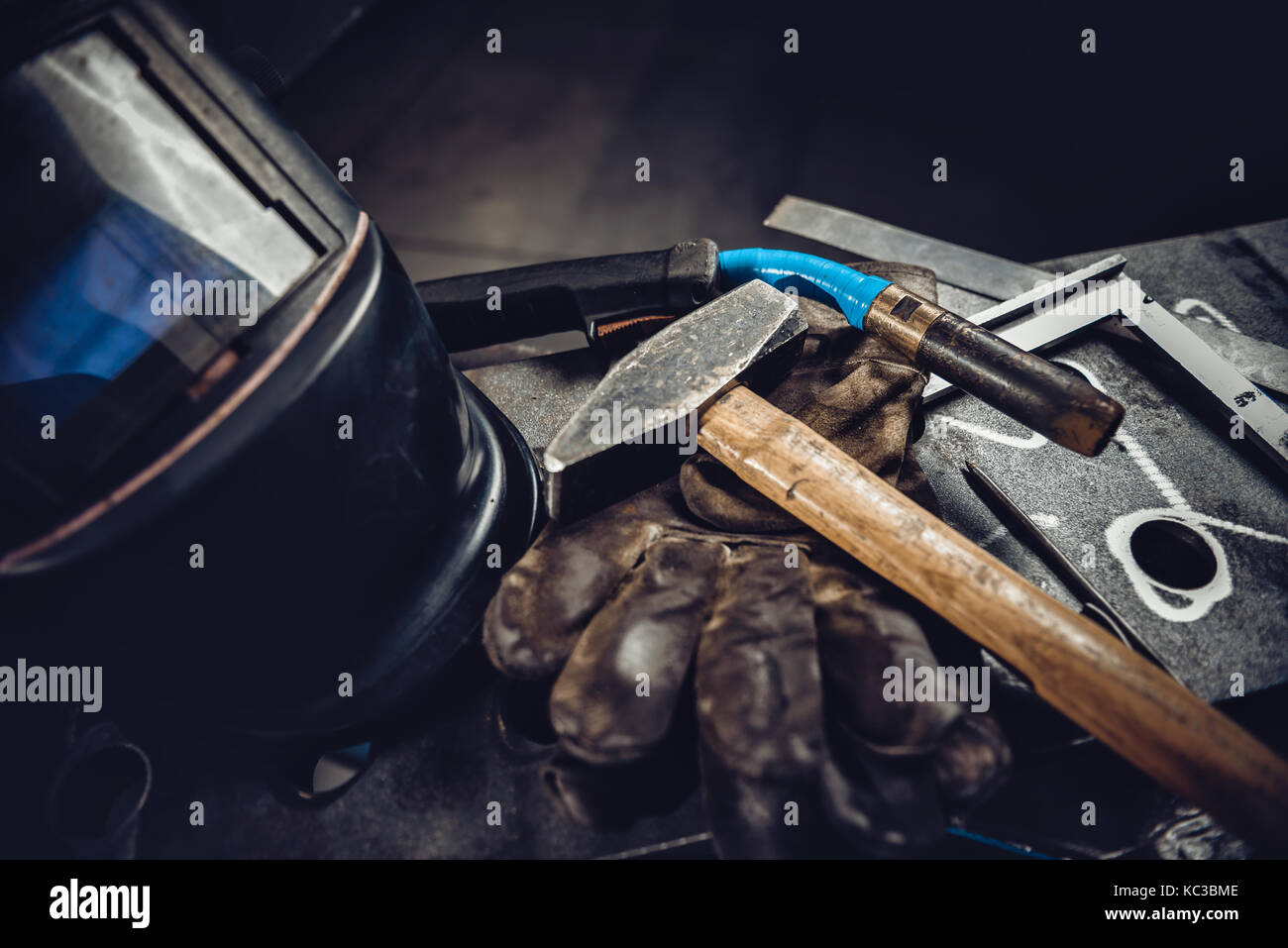 Industrial welding tool on metal profile background Stock Photo - Alamy