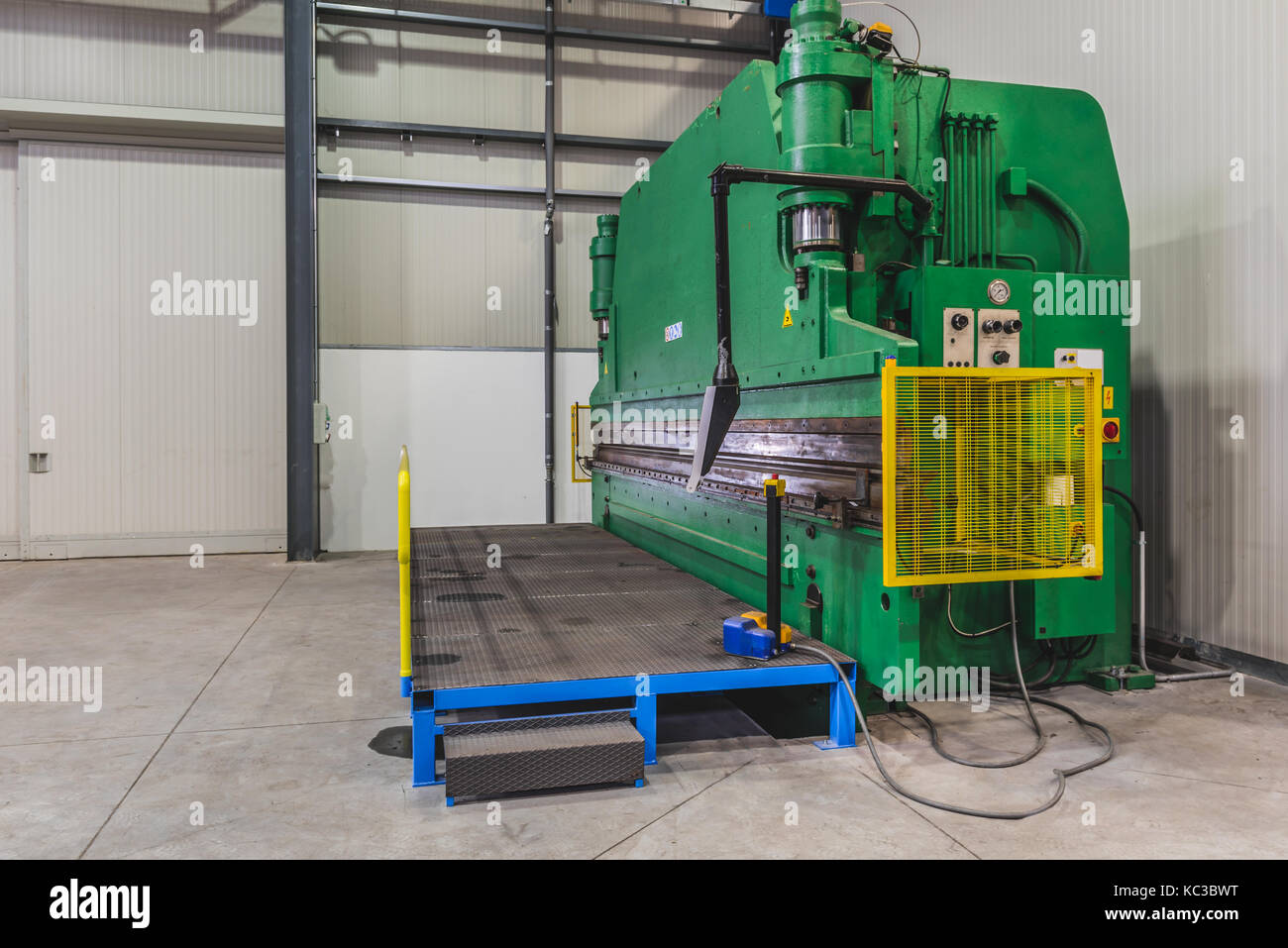 Green Hydraulic Press Brakes in industrial hall Stock Photo - Alamy