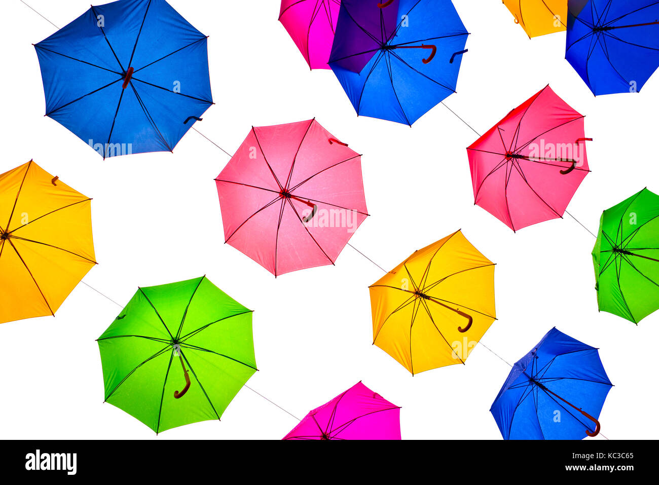 Many colorful umbrellas hanging, isolated on white background, view ...
