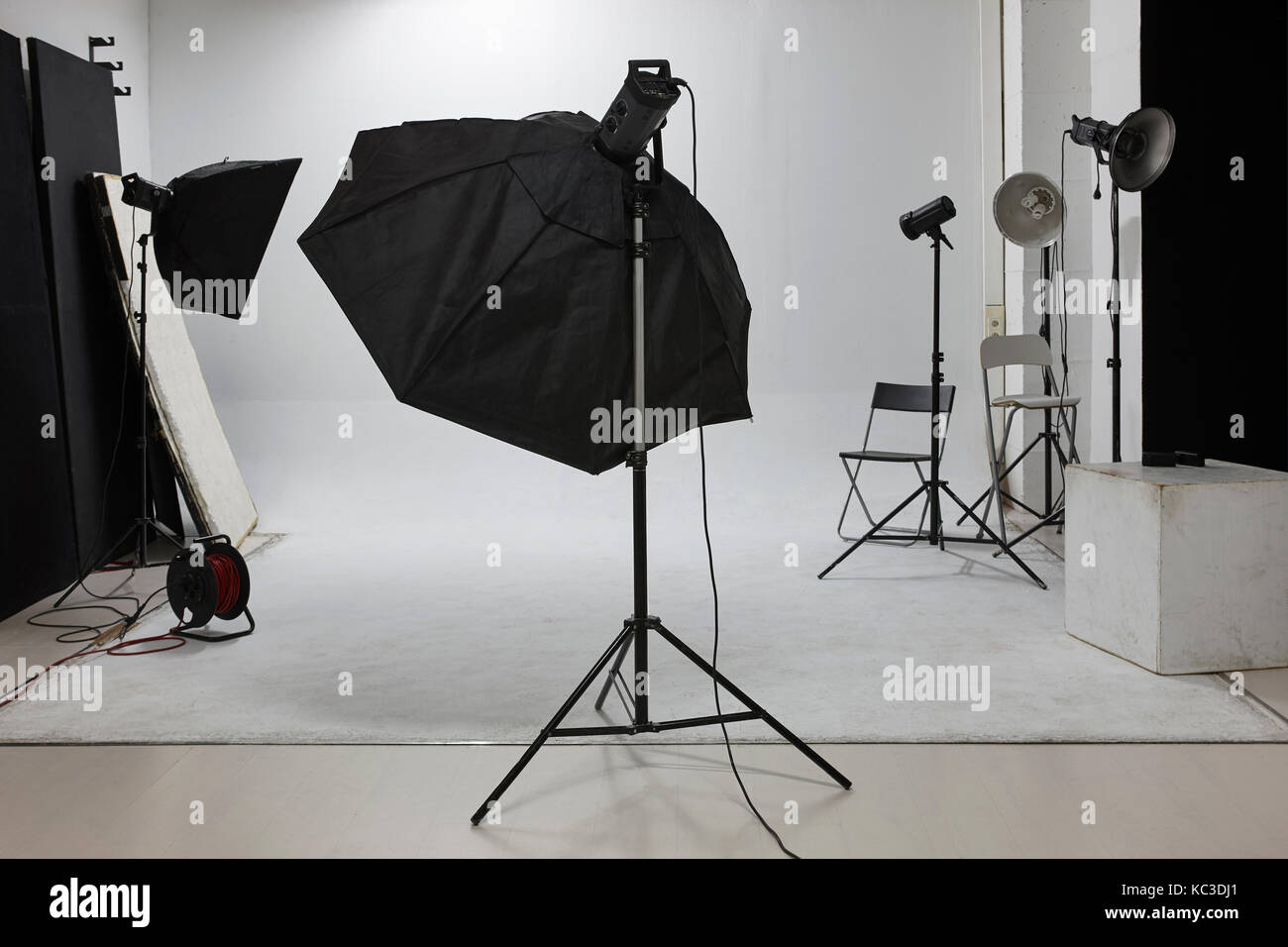 Professional photographic studio set with flashlights and white ...