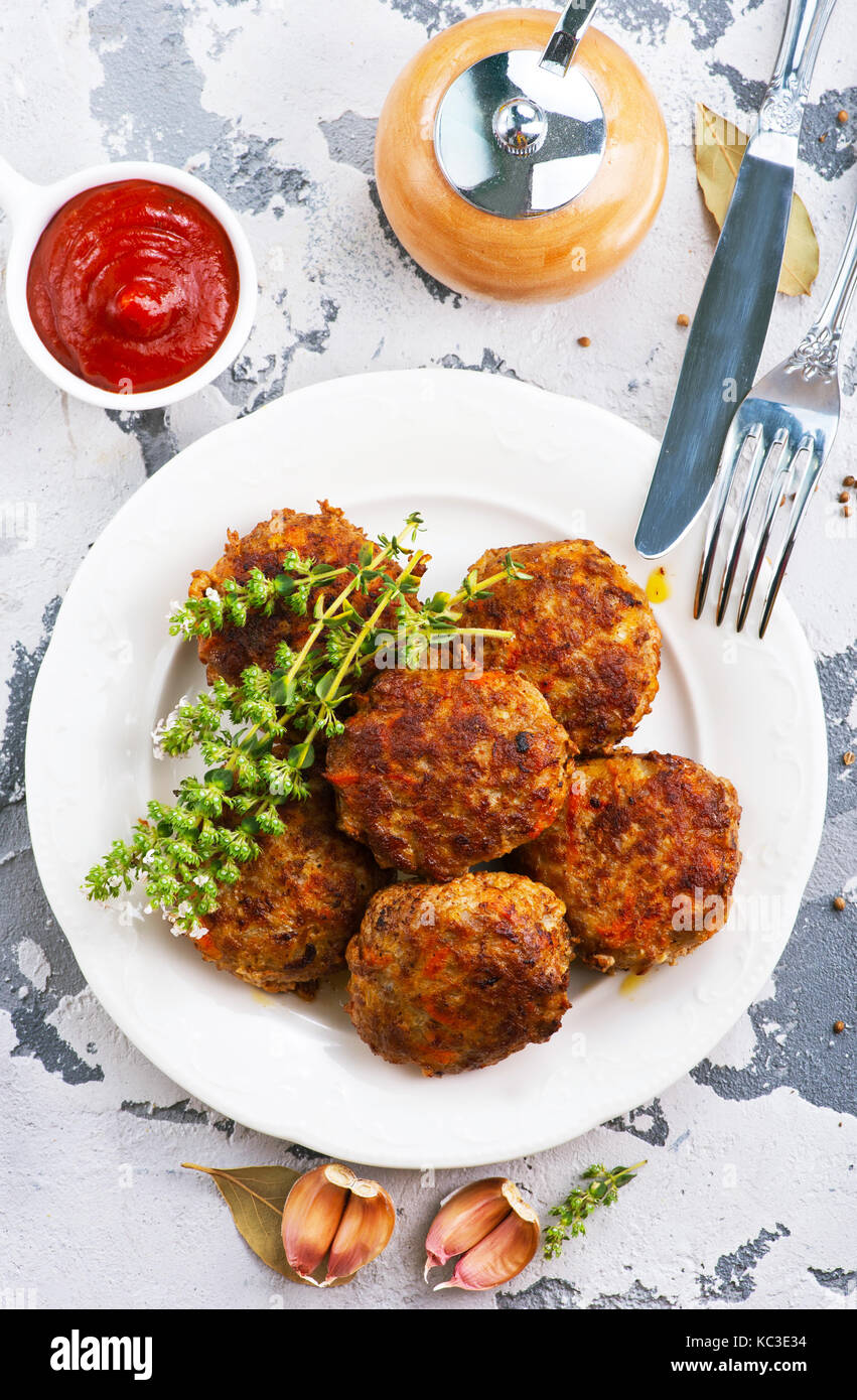 meatballs on plate and on a table Stock Photo - Alamy