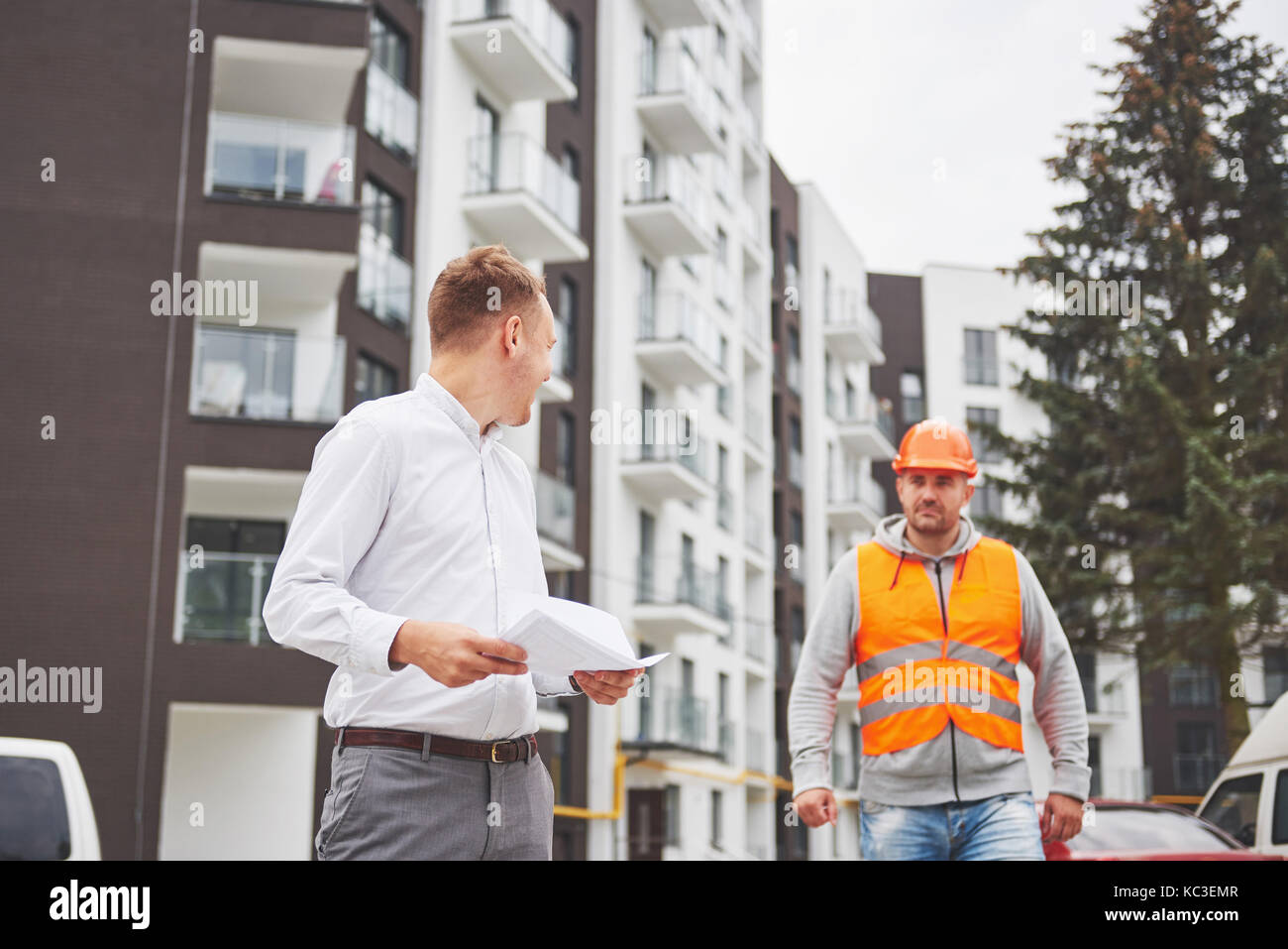 business, building, teamwork and people concept - group of smiling ...