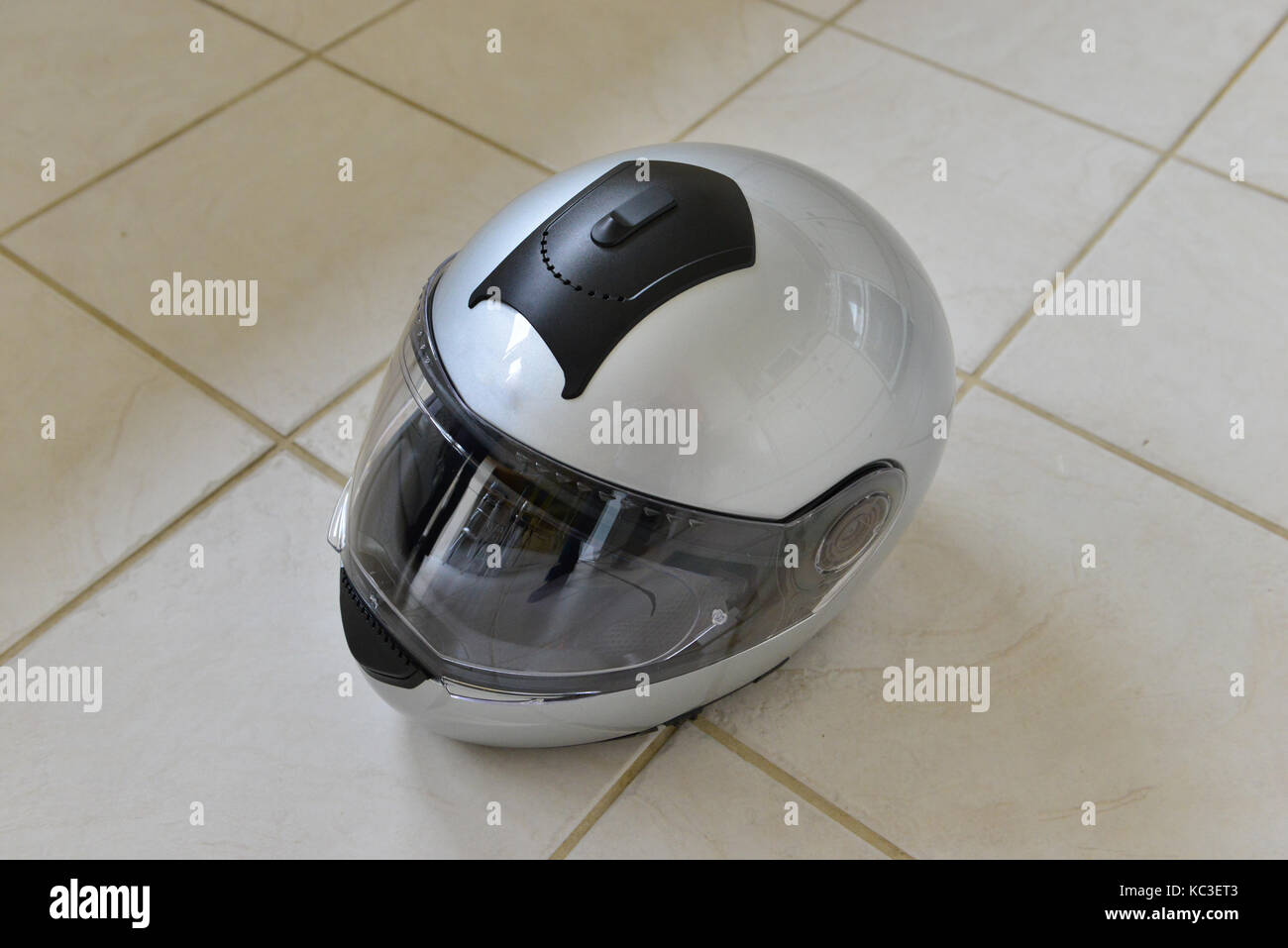 A Silver motorcycle Helmet Stock Photo - Alamy
