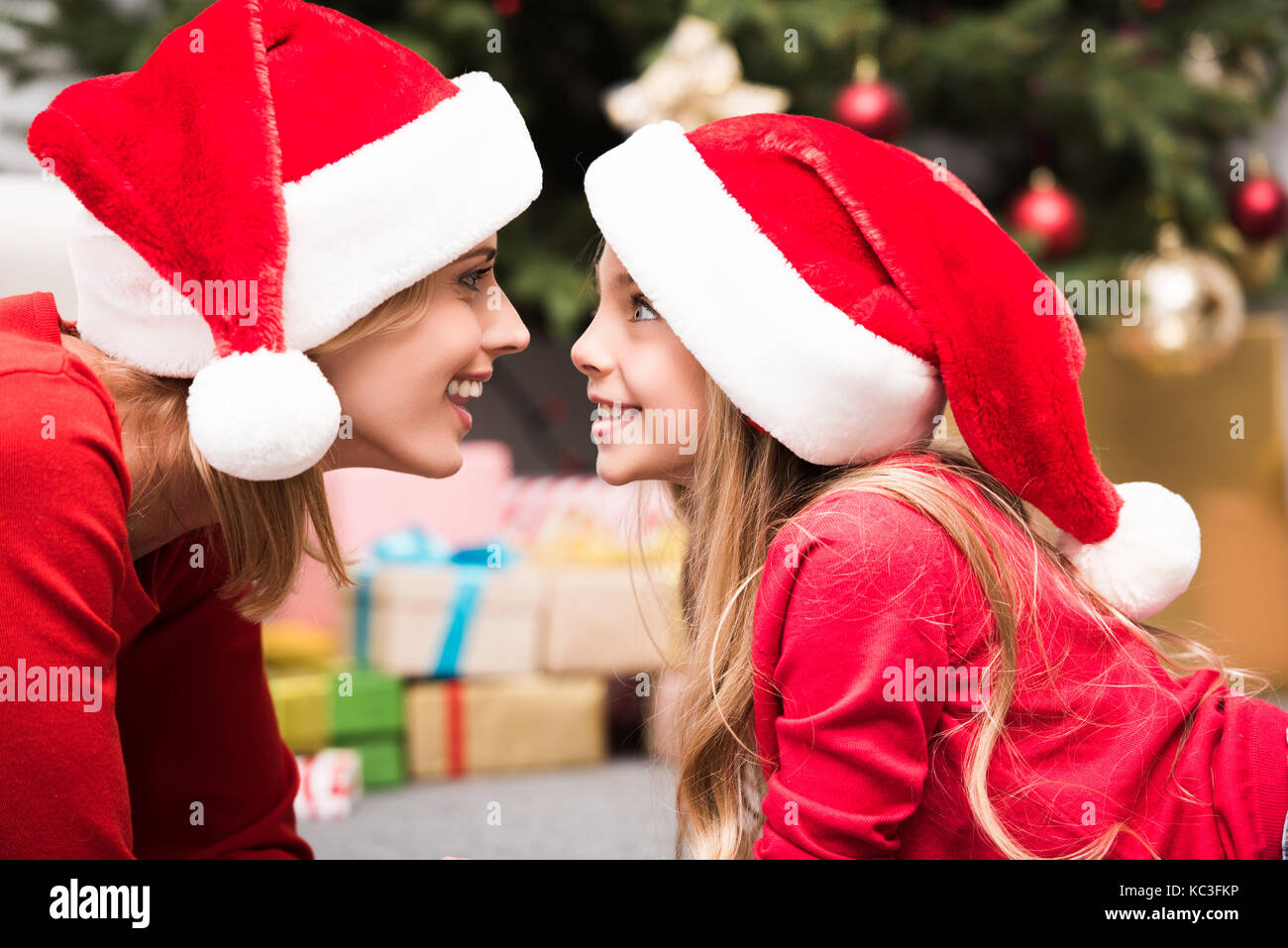 mother and daughter in Santa hats Stock Photo - Alamy