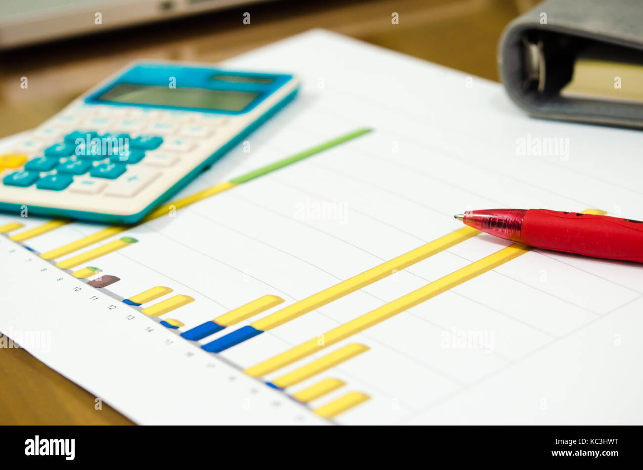 Business document with diagrams and notepad Stock Photo - Alamy
