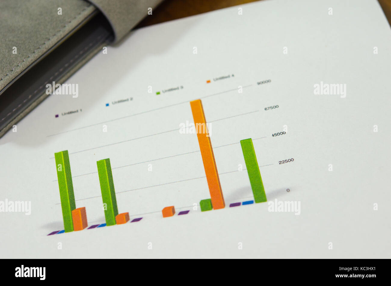 Business document with diagrams and notepad Stock Photo - Alamy