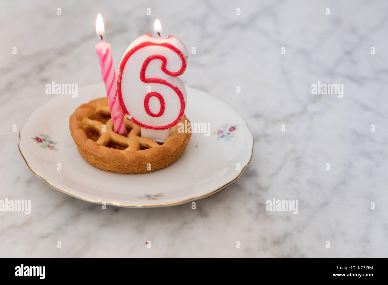 Birthday tart with 16 candles on background Stock Photo - Alamy
