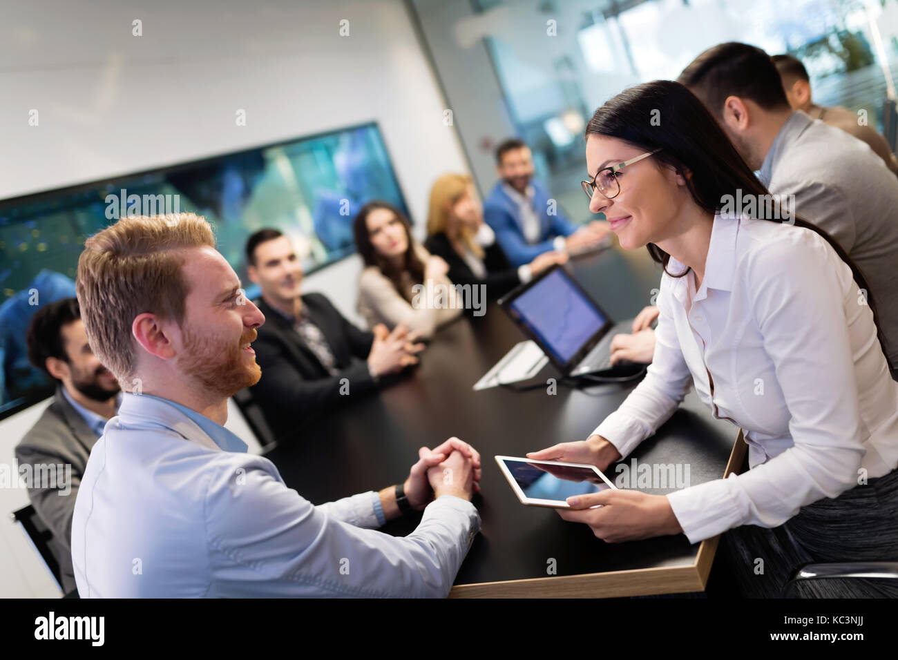 Portrait of business couple in conference room Stock Photo - Alamy