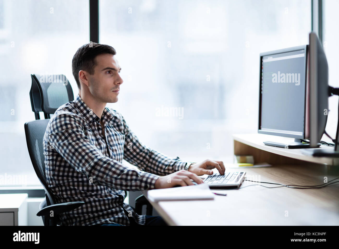 Portrait focused employee computer hi-res stock photography and images ...