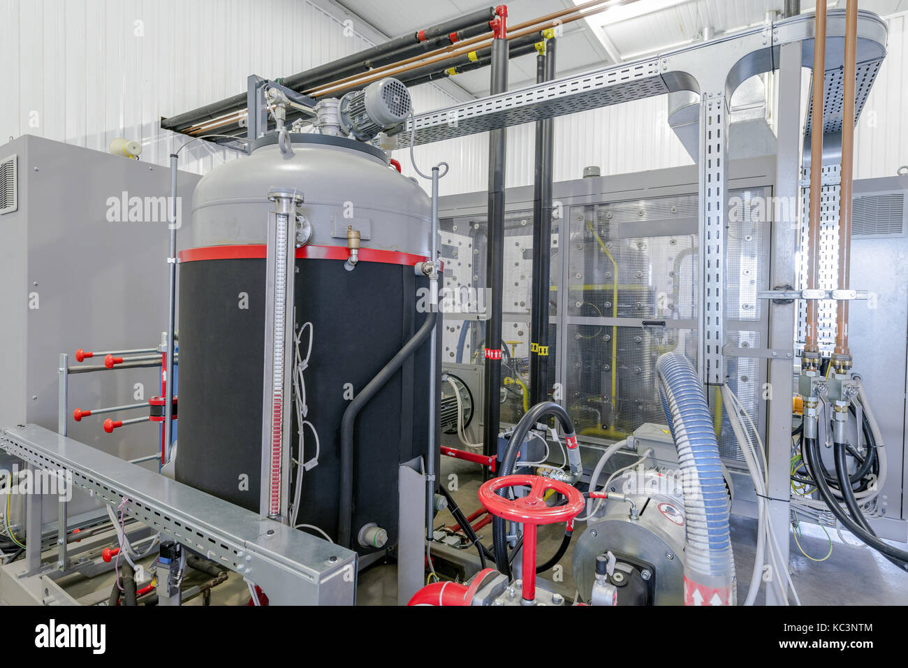 workshop with containers and tanks for the production of polyurethane ...