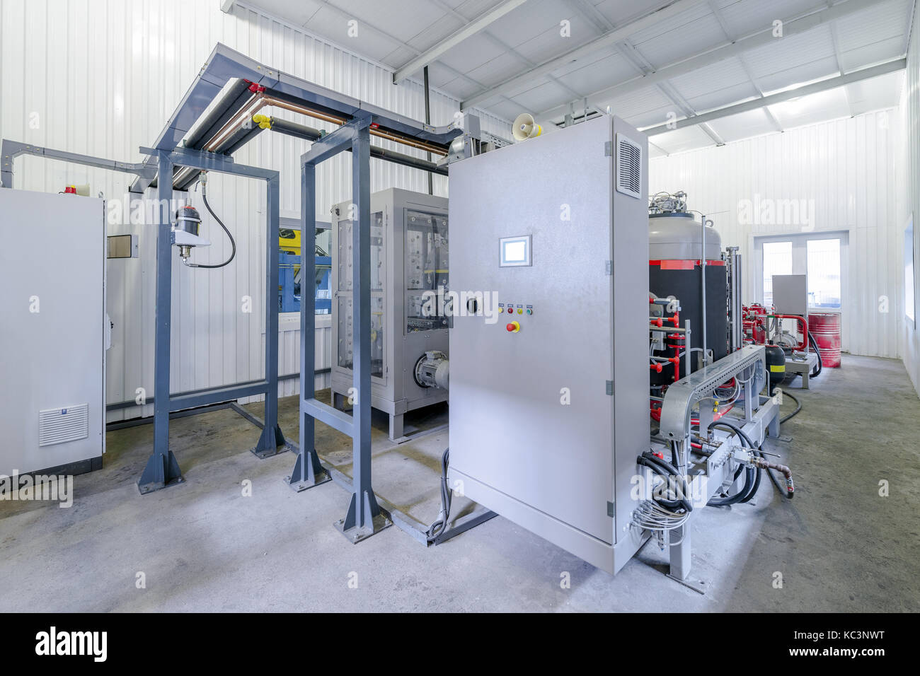 workshop with containers and tanks for the production of polyurethane ...
