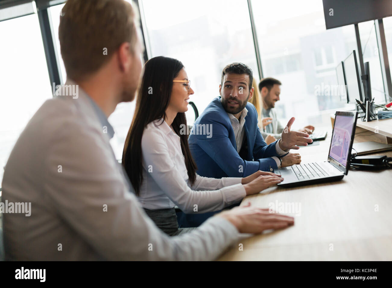 Young businesspeople working on computer in office Stock Photo - Alamy