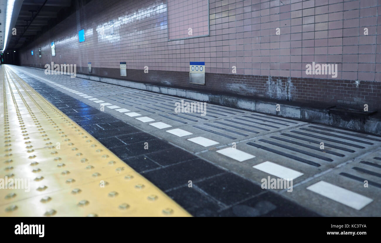 Old and dirty train platform or underground subway station in Osaka ...