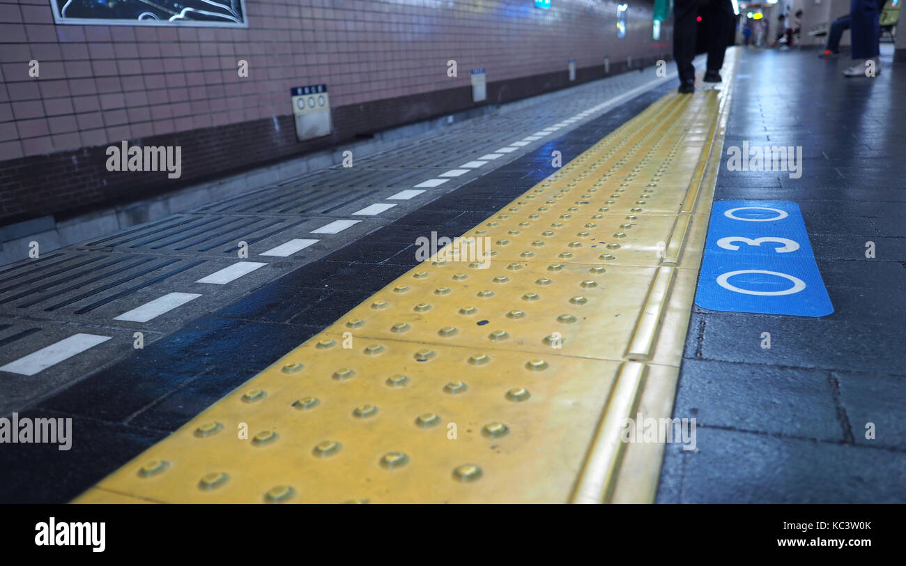 Old and dirty train platform or underground subway station in Osaka ...