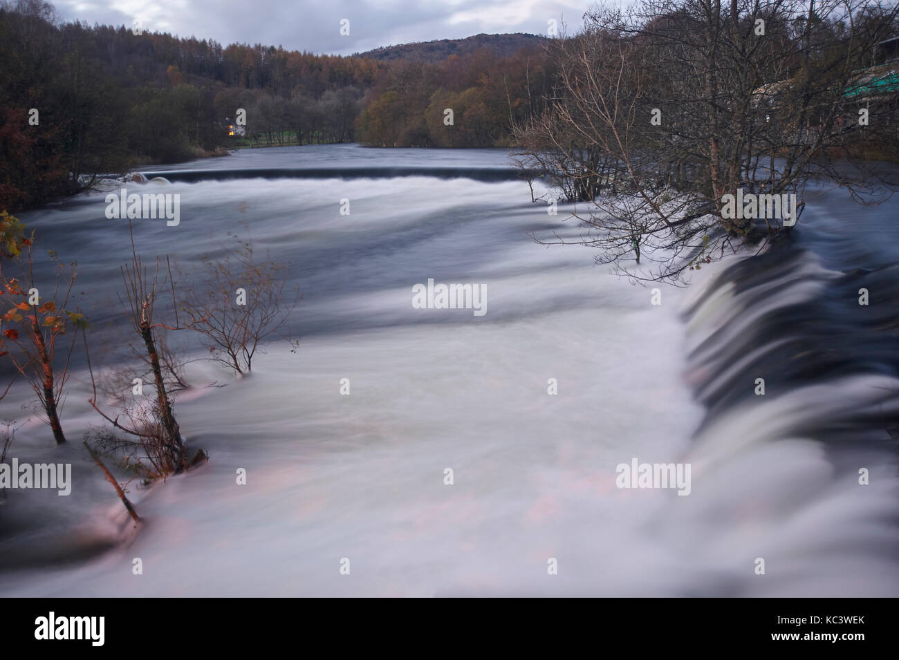 Landscape with torrent of overflowing river flood water, Lake District ...