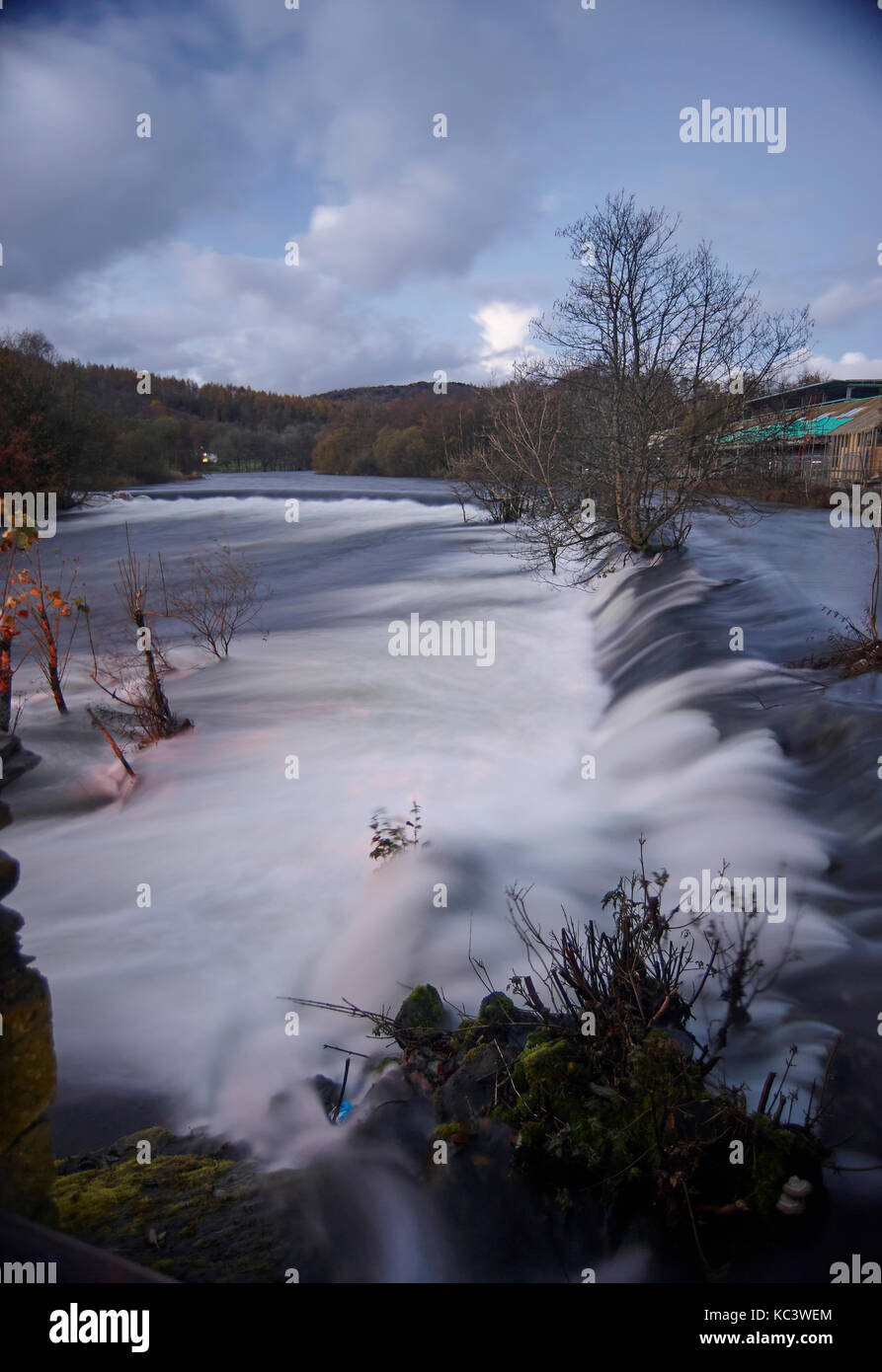 Landscape with torrent of overflowing river flood water, Lake District ...