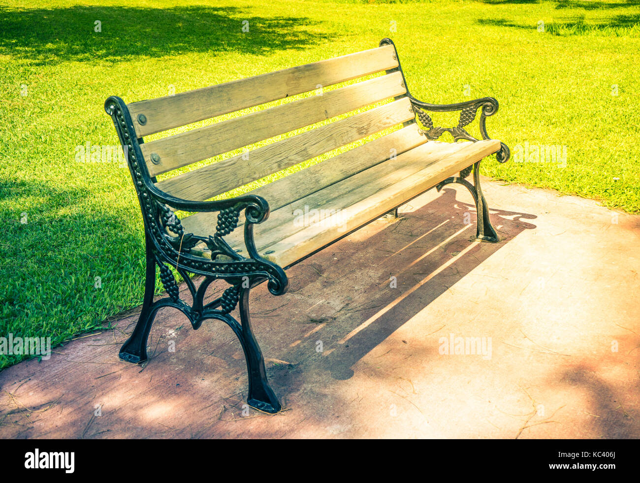 Old styled wooden park bench in a city park Stock Photo - Alamy