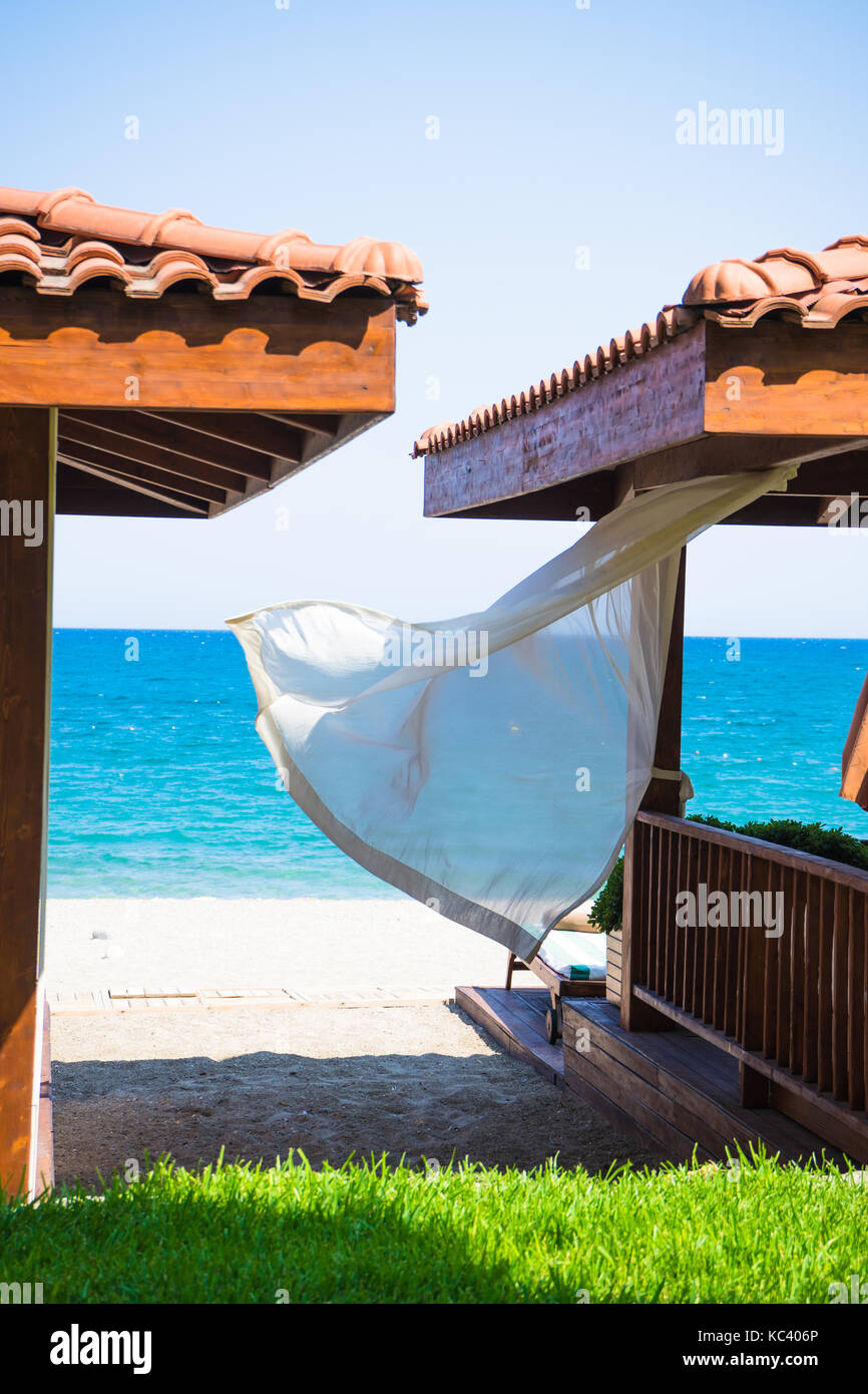 summertime relax on the sand beach with sea waves and beach cabin Stock ...