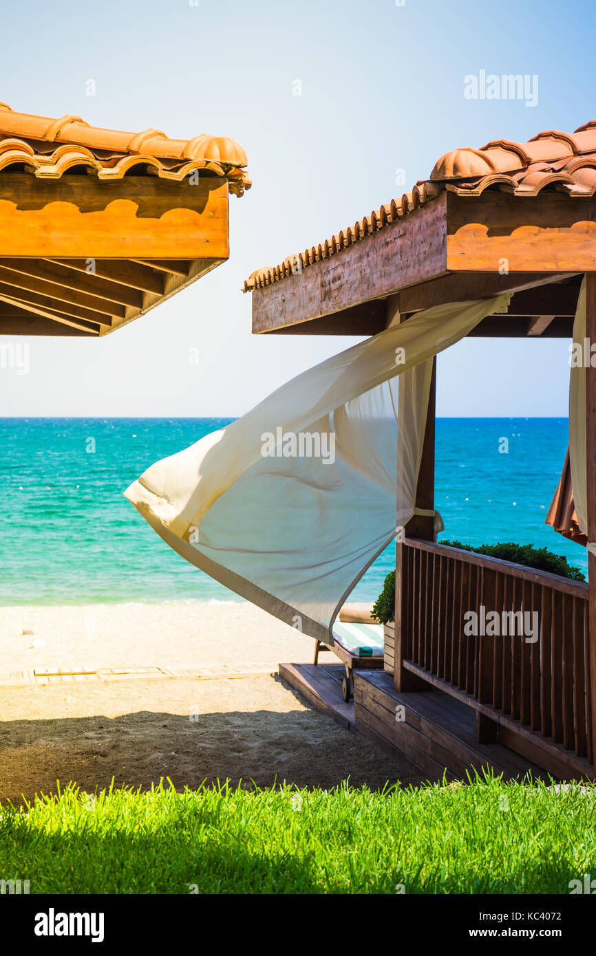 summertime relax on the sand beach with sea waves and beach cabin Stock ...