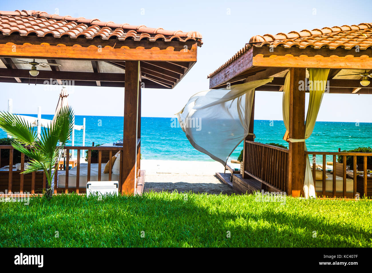 summertime relax on the sand beach with sea waves and beach cabin Stock ...