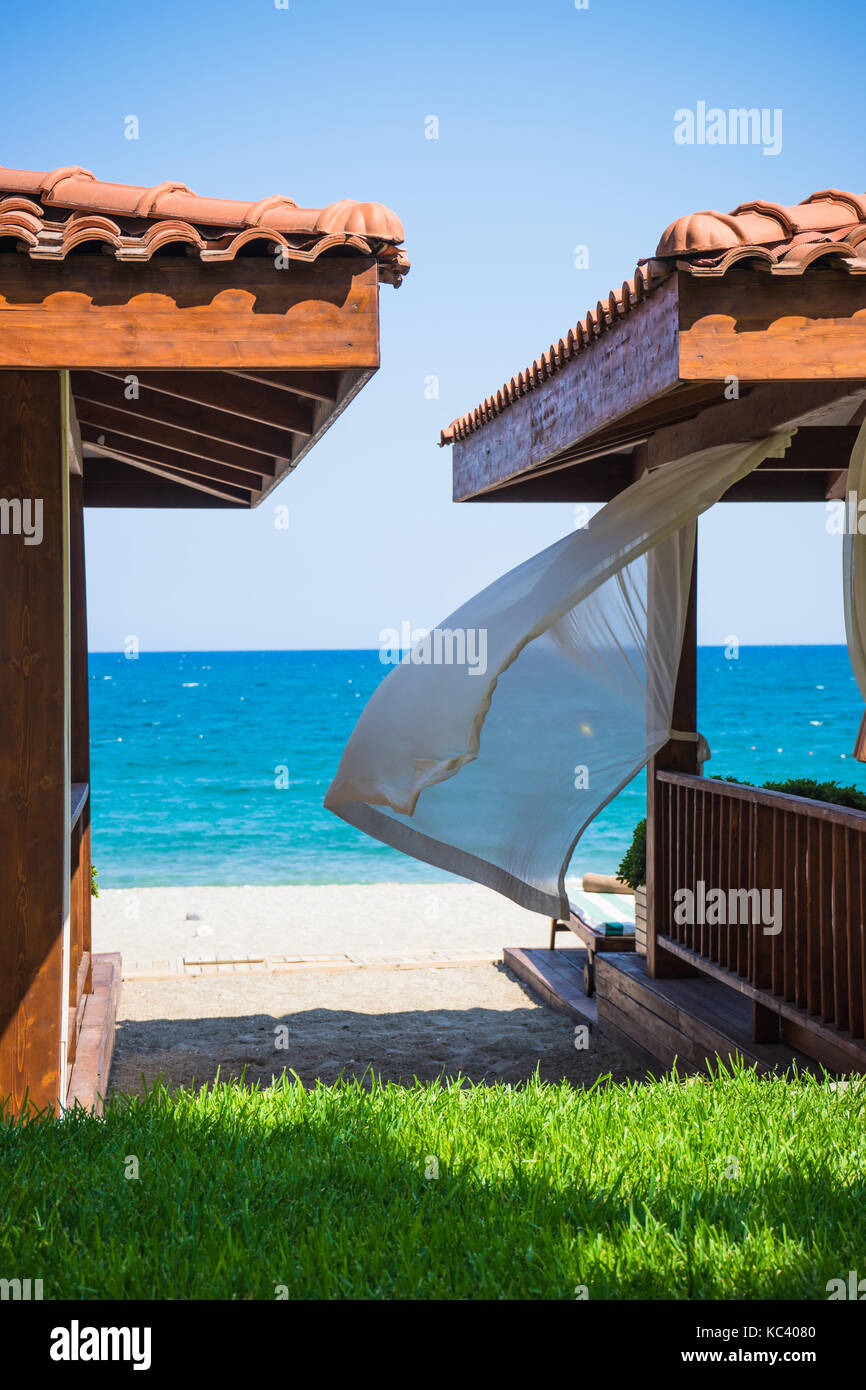 summertime relax on the sand beach with sea waves and beach cabin Stock ...
