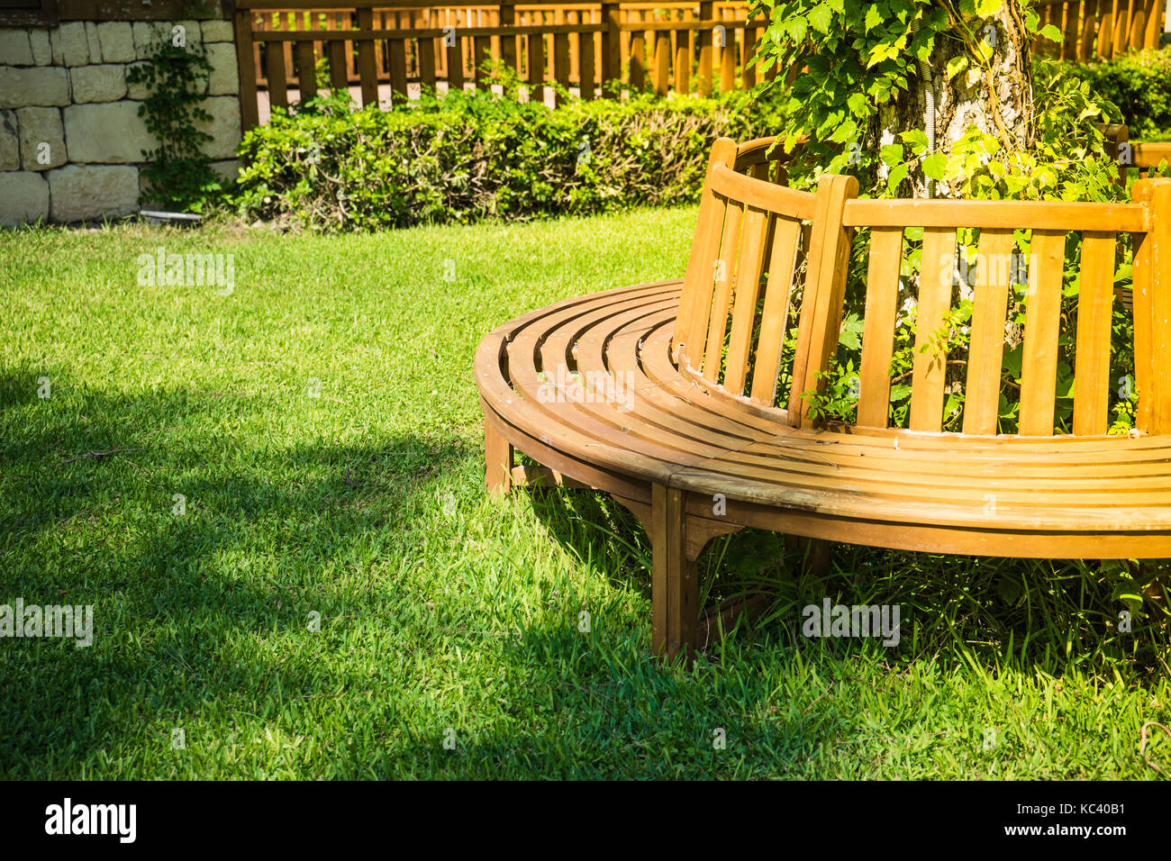 Old styled wooden park bench in a city park Stock Photo - Alamy