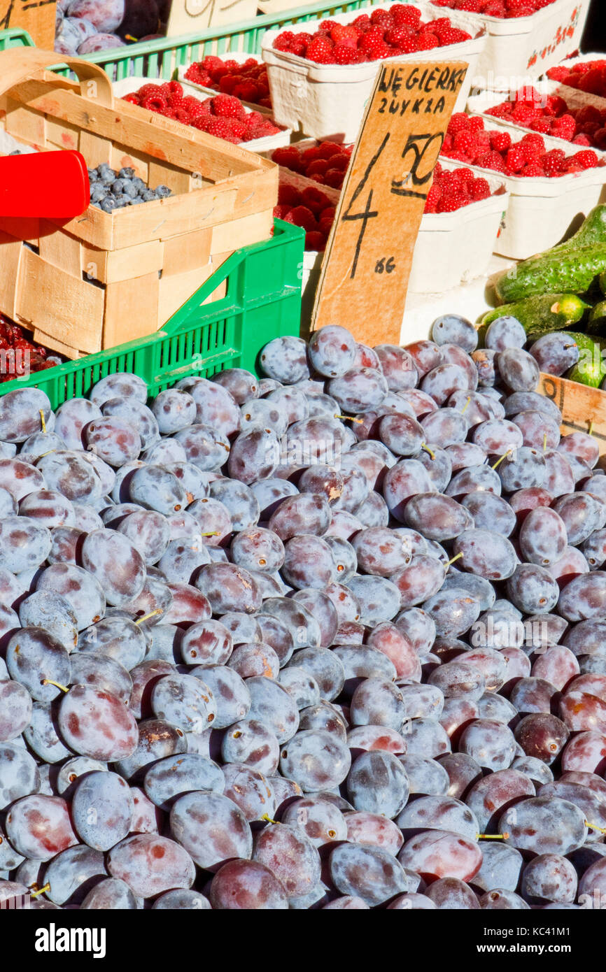 Plums and raspberries for sale on an outdoor market in Warsaw, Poland ...