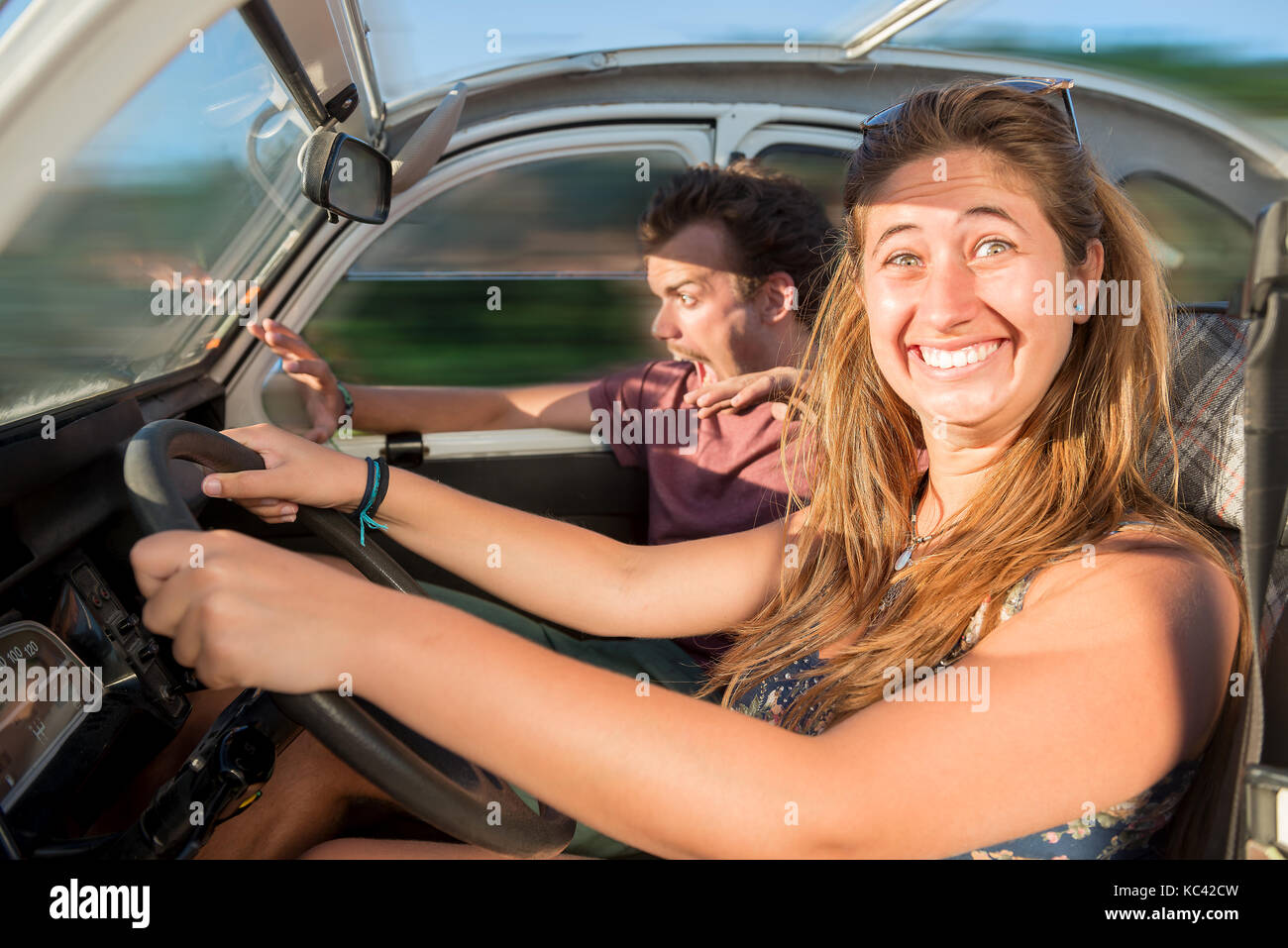 Happy girl driving hi-res stock photography and images - Alamy