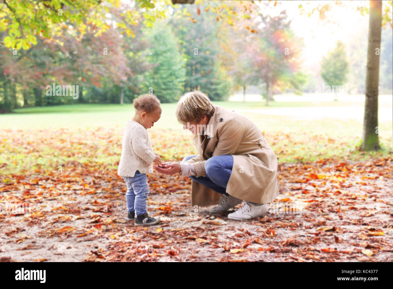 Family playing outside in fall Stock Photo - Alamy