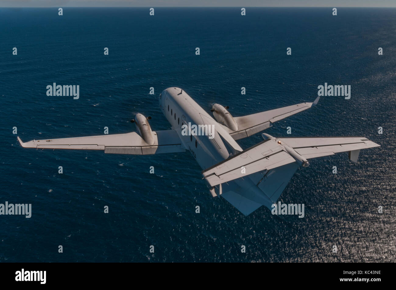 An air-to-air, rear end portrait of a Raytheon Beechcraft B1900D ...