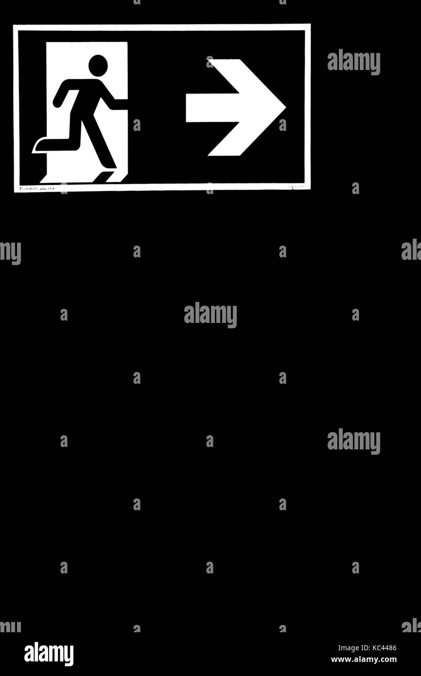 An emergency exit sign and warning sign for an escape route in abstract ...