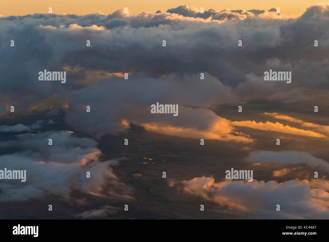 An aerial view from 20'000 feet over a sunset cloudscape Stock Photo ...