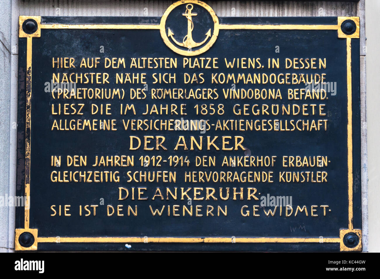 Anker Clock, Vienna. The board attached to the house informs about the ...