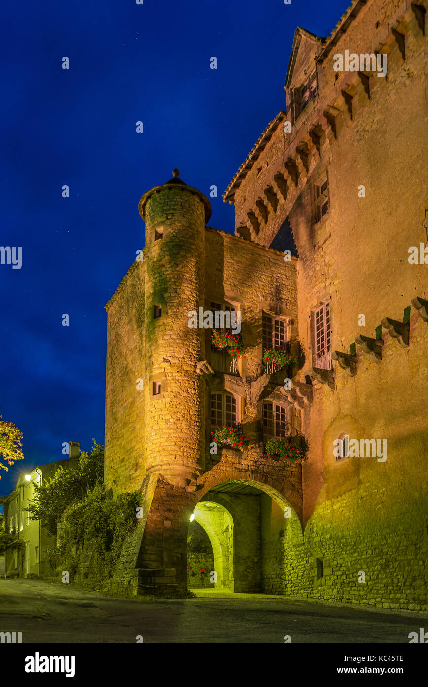 A twilight view of the medieval village of Varen in the Tarn region ...