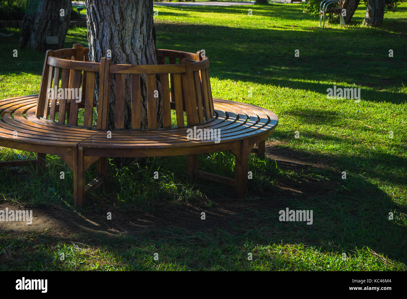 Old styled wooden park bench in a city park Stock Photo - Alamy