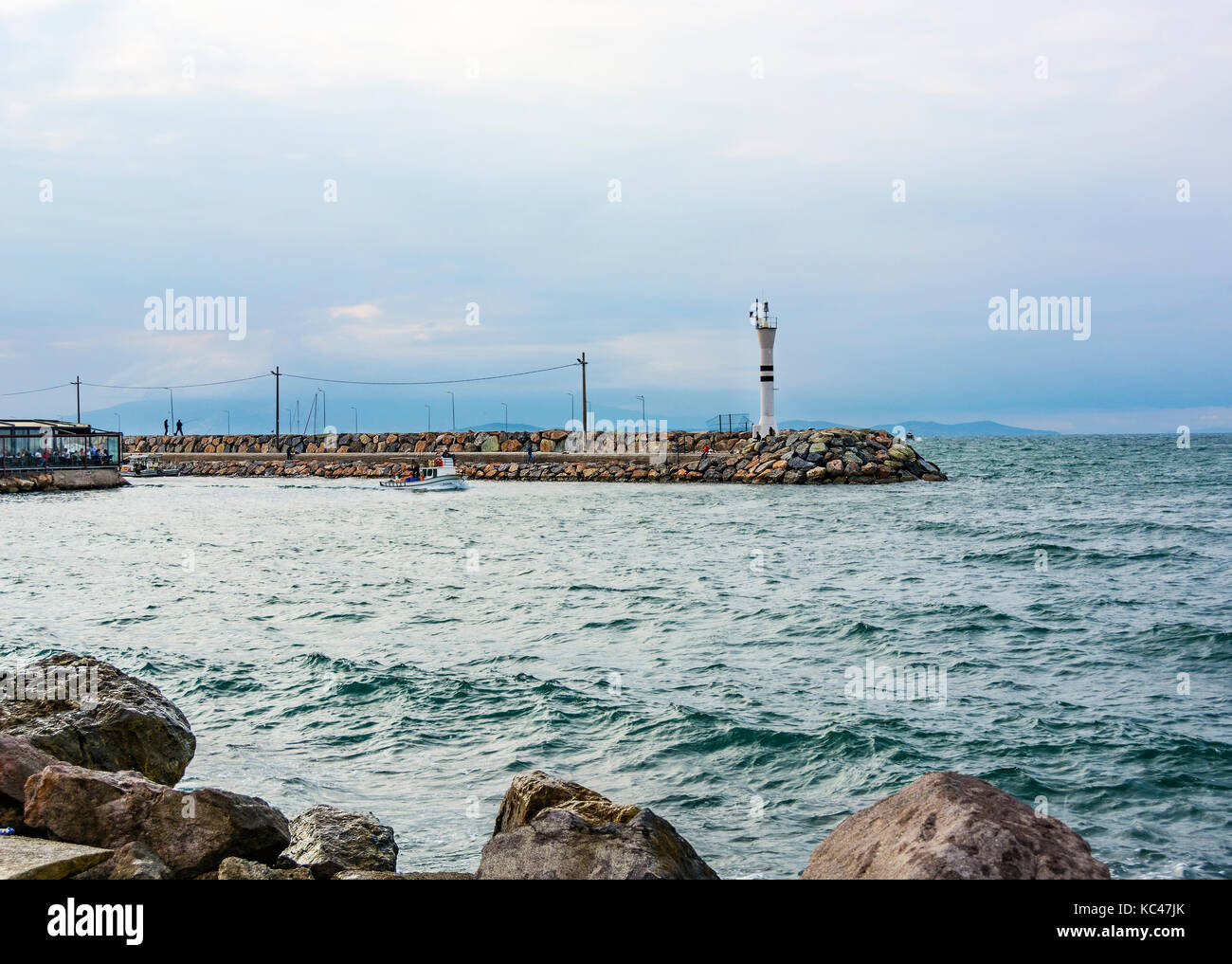 sea lighthouse and fishing port Stock Photo - Alamy