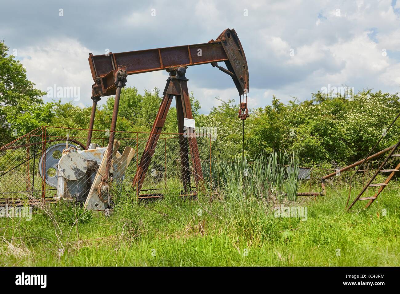 Oil well on a landscape Stock Photo - Alamy