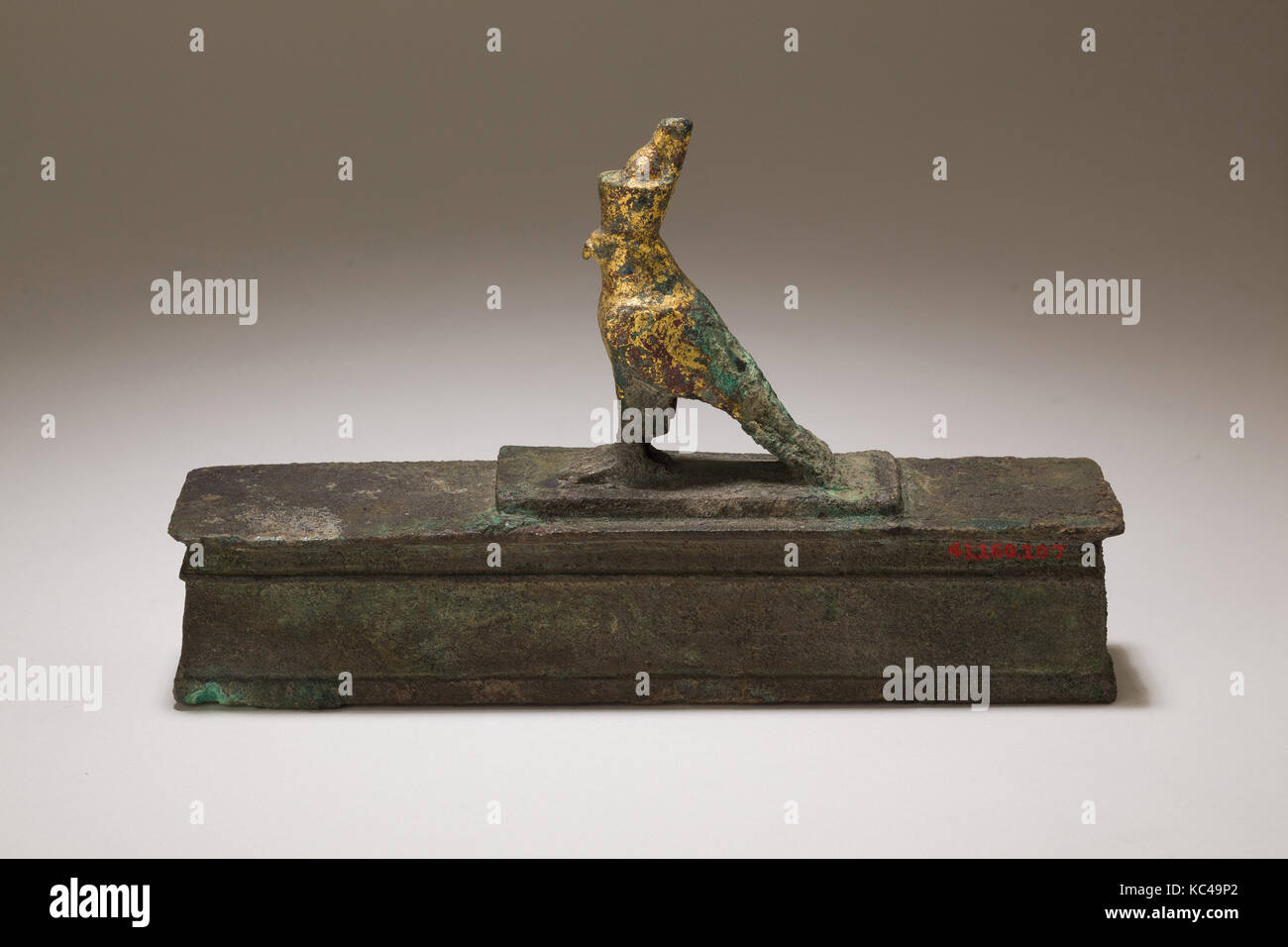 Falcon in double crown surmounting a shrine shaped box for an animal ...