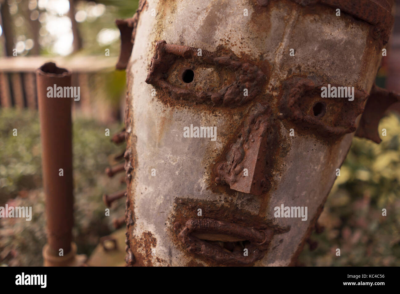 Old Rusty Metal Face In A Garden Stock Photo - Alamy